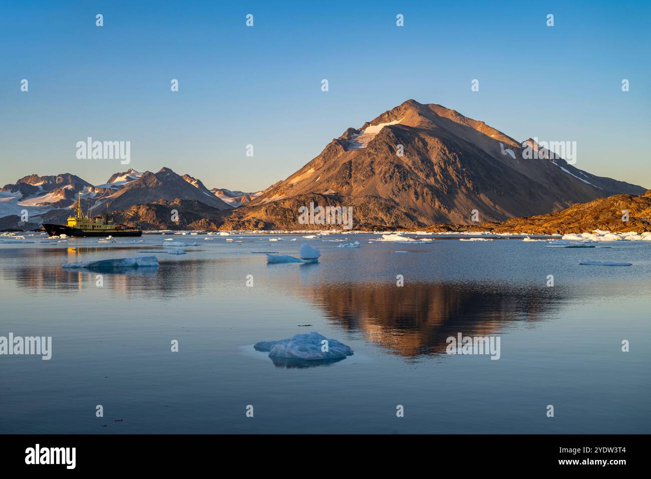 Fishing trawler in the mountainous fjord, Kulusuk, Greenland, Denmark ...