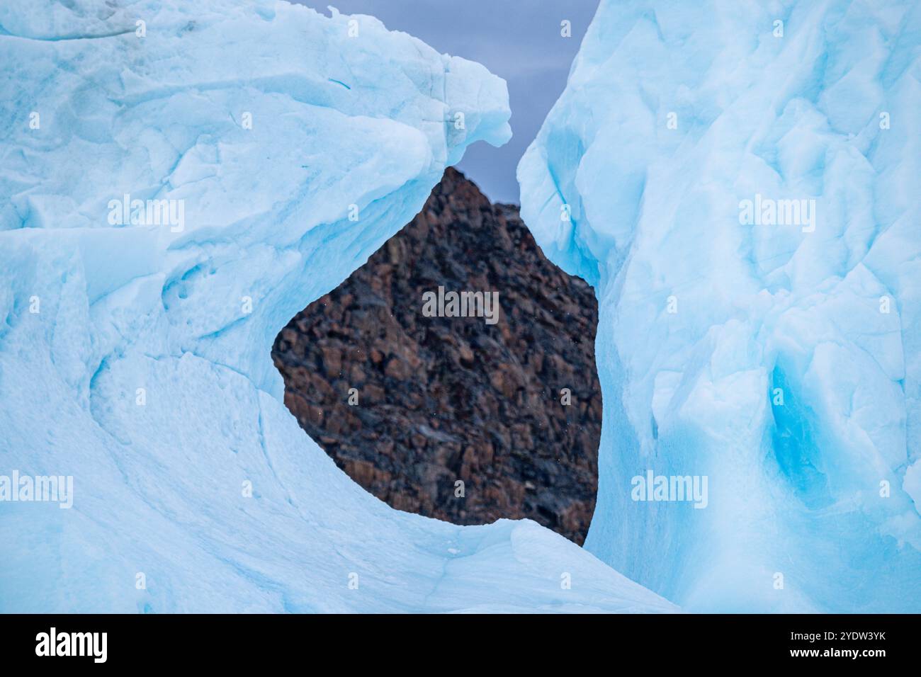Hole in an iceberg, Belcher island, Devon island, Nunavut, Canadian ...