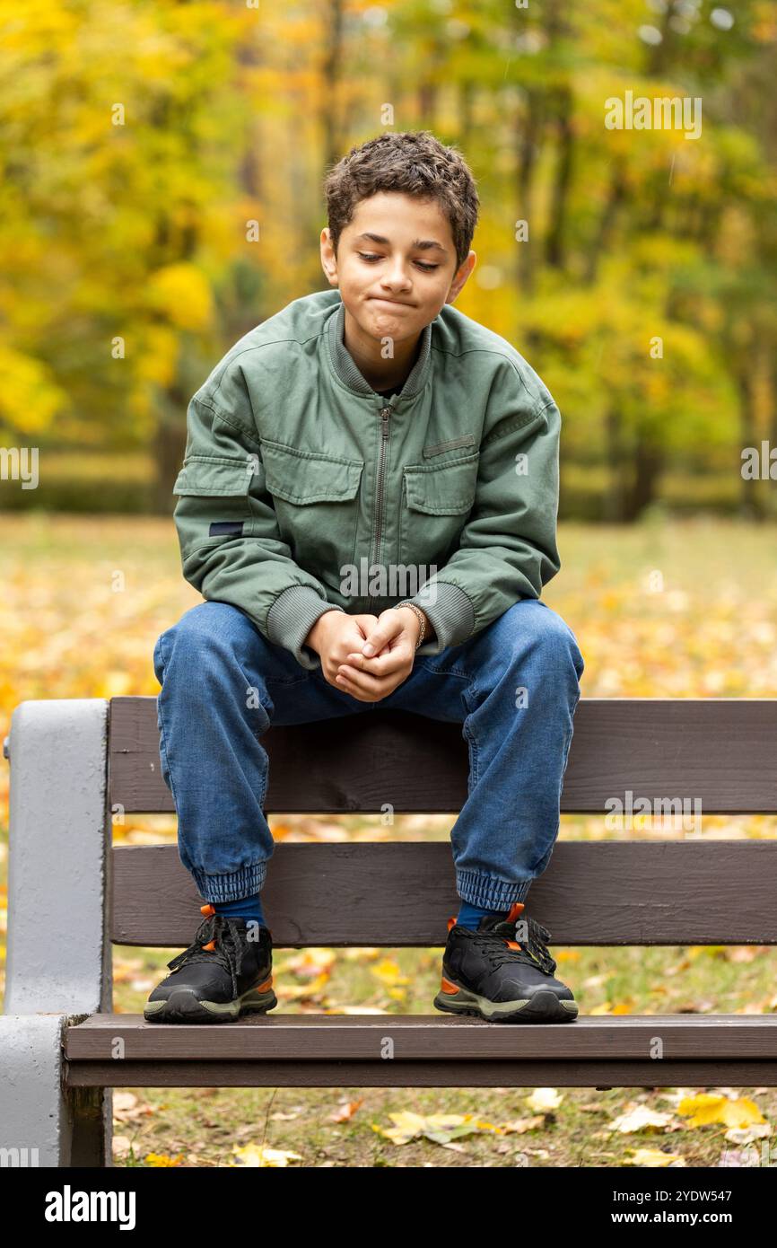 Sad teenager boy sit on hi-res stock photography and images - Alamy