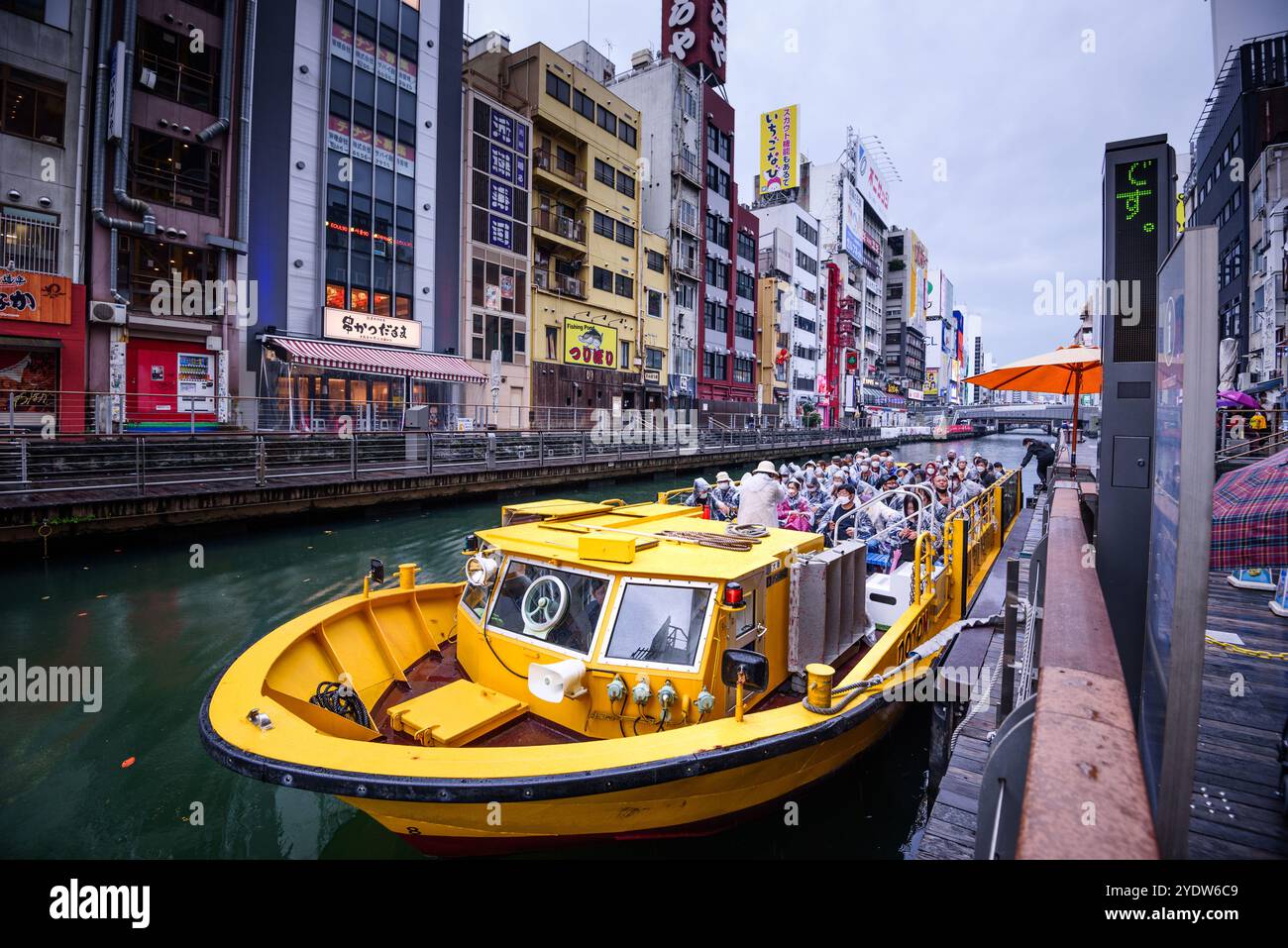 Yellow cruising boat on the Dotonbori river, Osaka,Honshu, Japan, Asia ...