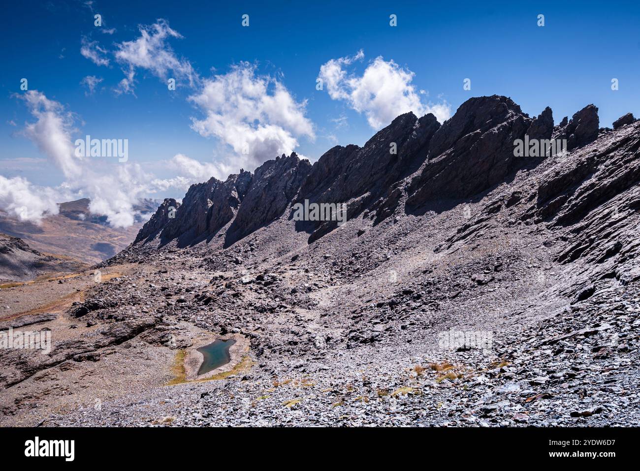 Dramatic rugged mountain range with a lake, Laguna del Rio Secco and ...