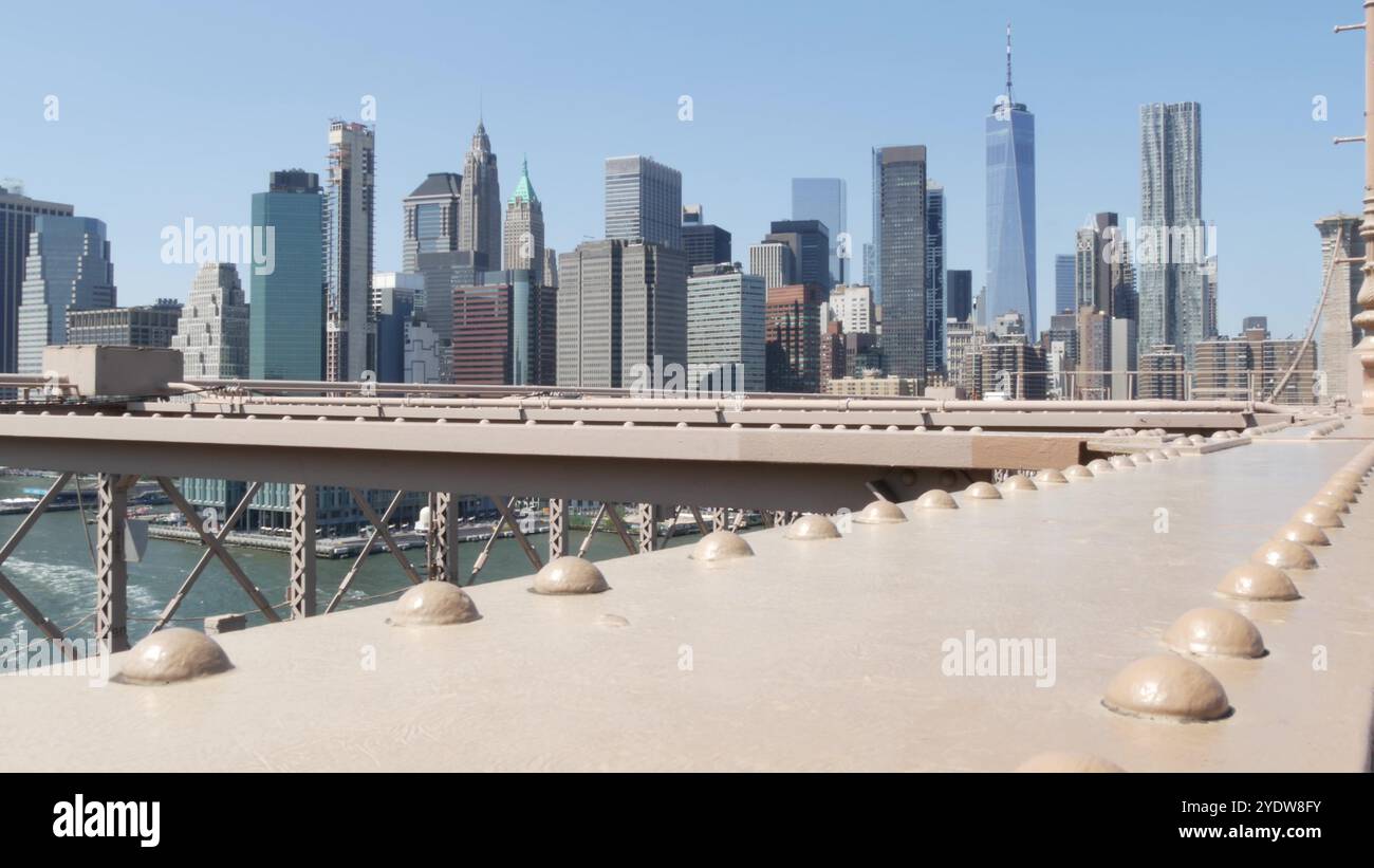 Brooklyn Bridge to Manhattan downtown. New York City skyline, financial ...