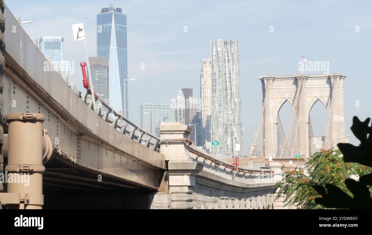 Brooklyn Bridge to Manhattan downtown. New York City skyline, financial ...