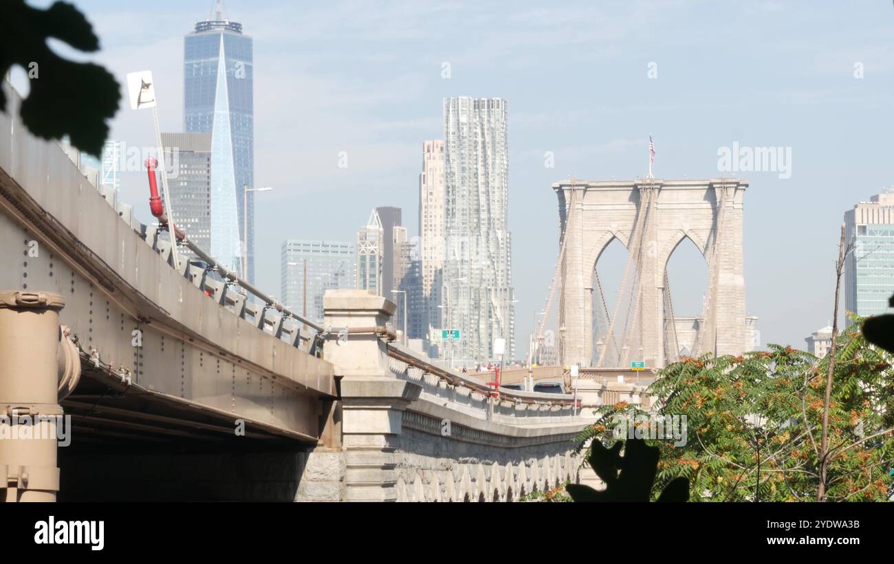 Brooklyn Bridge to Manhattan downtown. New York City skyline, financial ...