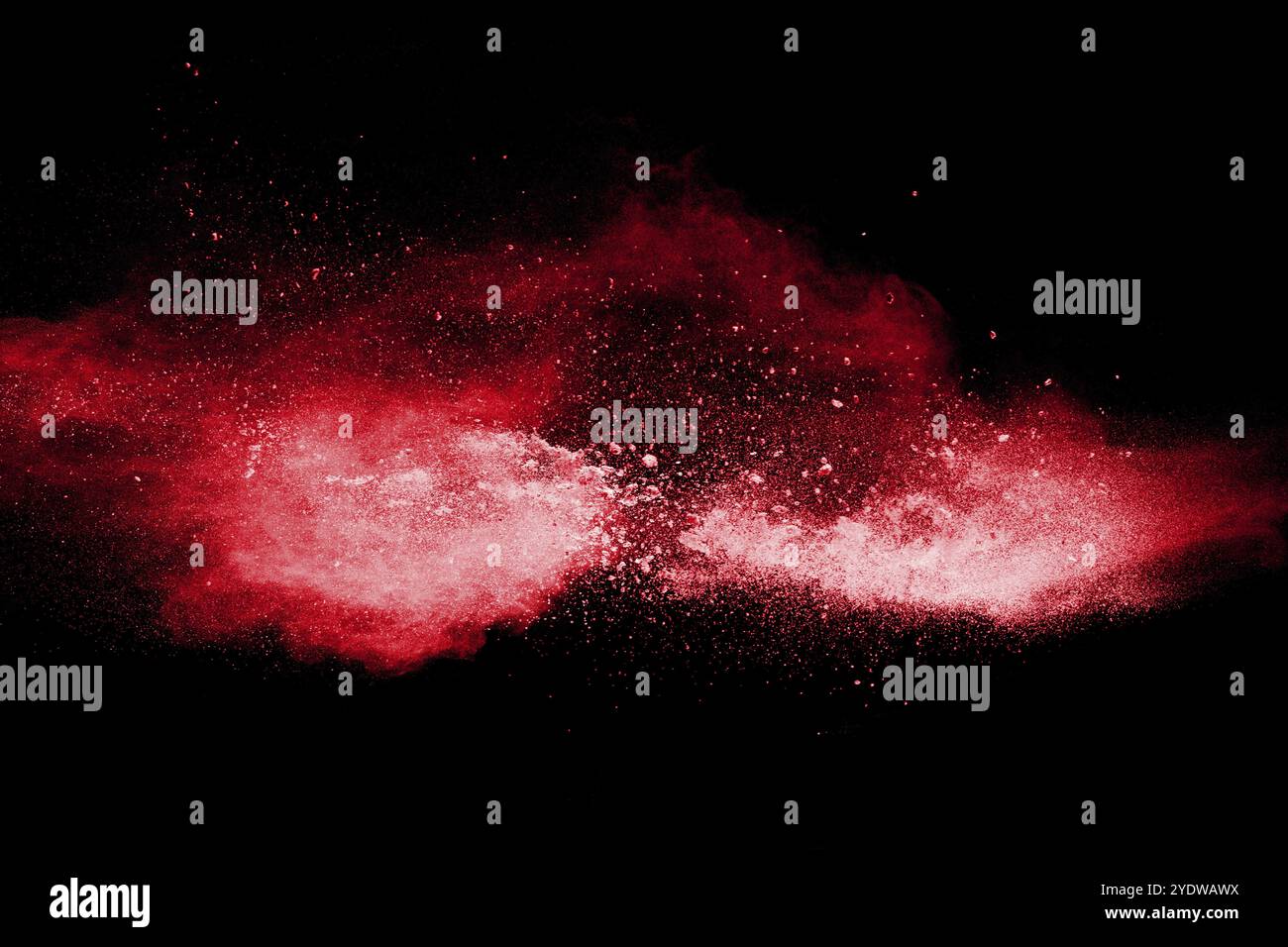 Red color powder explosion on black background.Freeze motion of red ...