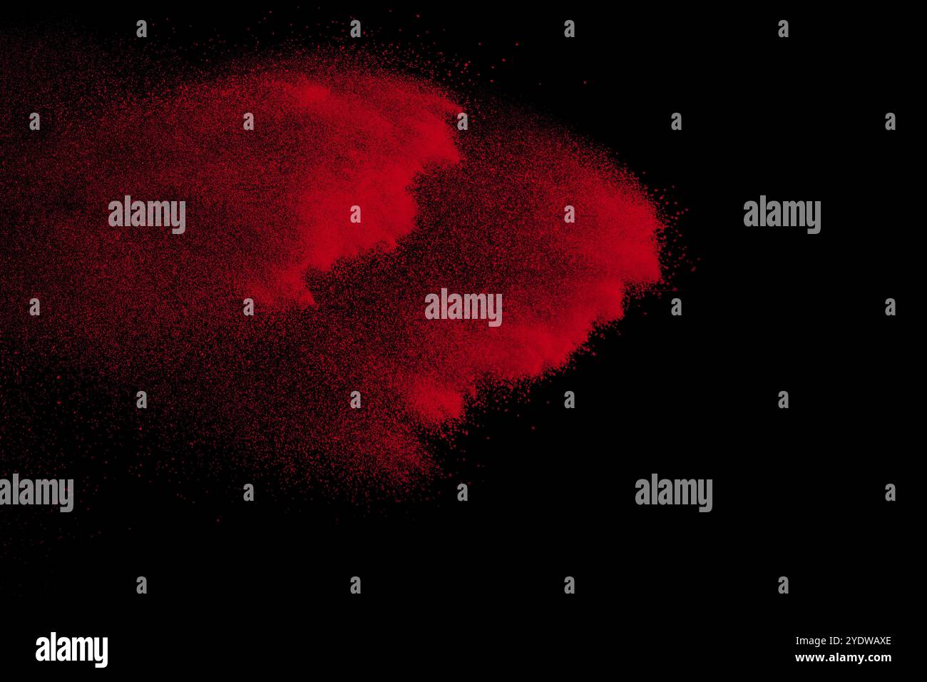 Red color powder explosion on black background.Freeze motion of red ...