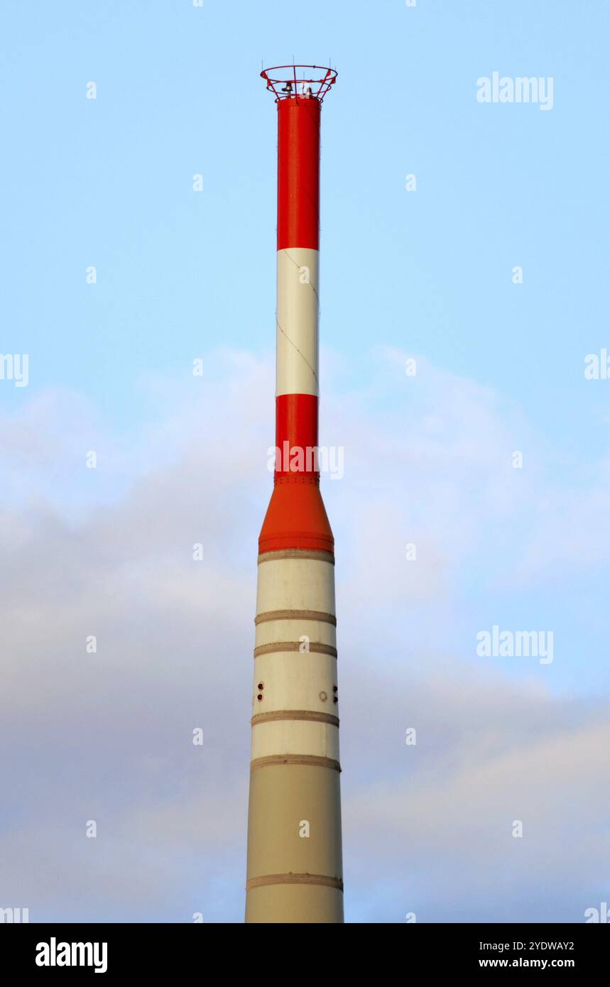 Spire and antenna of a radio tower with red and white markings and ...