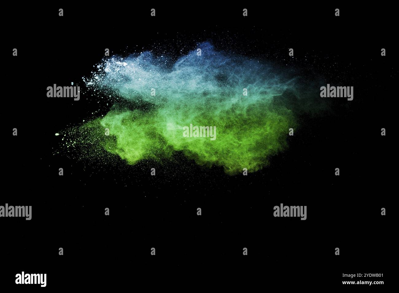 Launched blue green color powder explosion on black background Stock ...