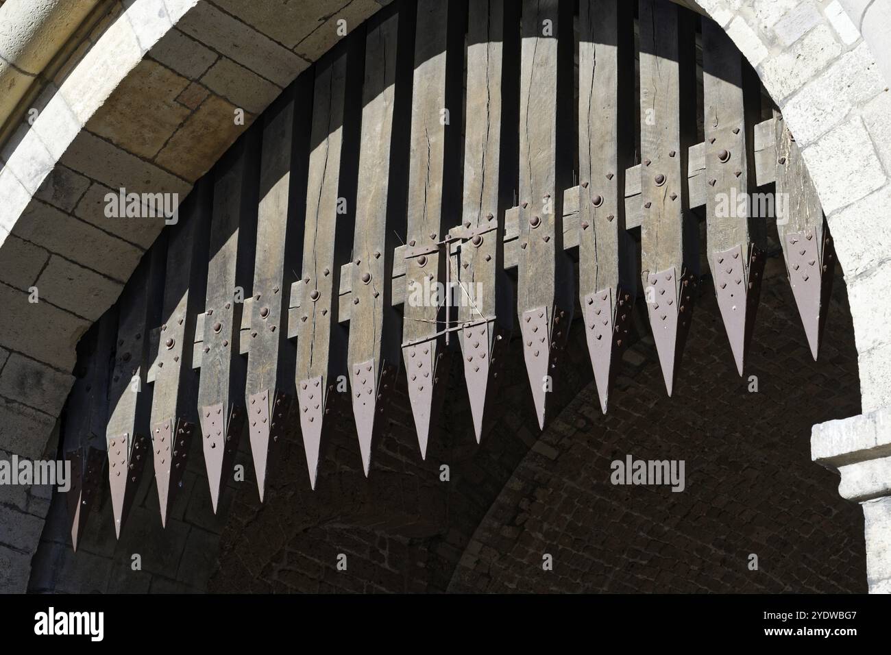A portcullis with metal spikes from a medieval gate castle in Cologne ...