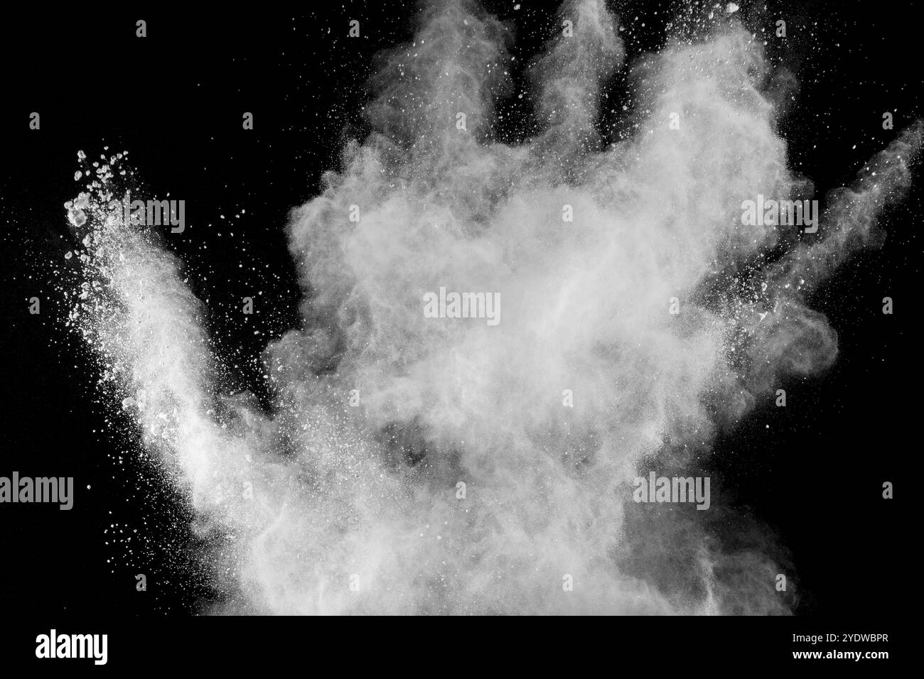 Bizarre forms of white powder explosion cloud against black background ...