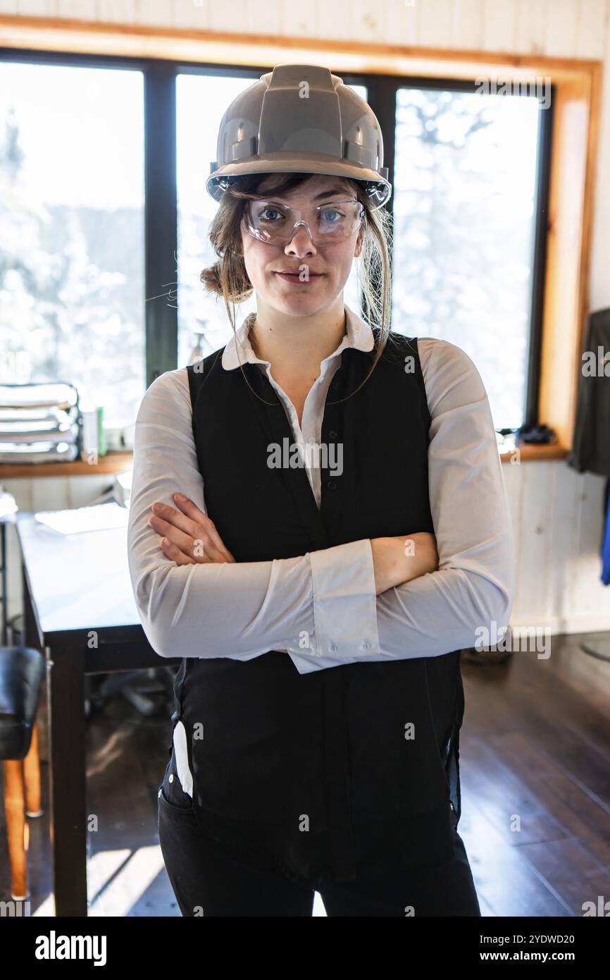 Young attractive caucasian woman with crossed arms pose as she wearing ...