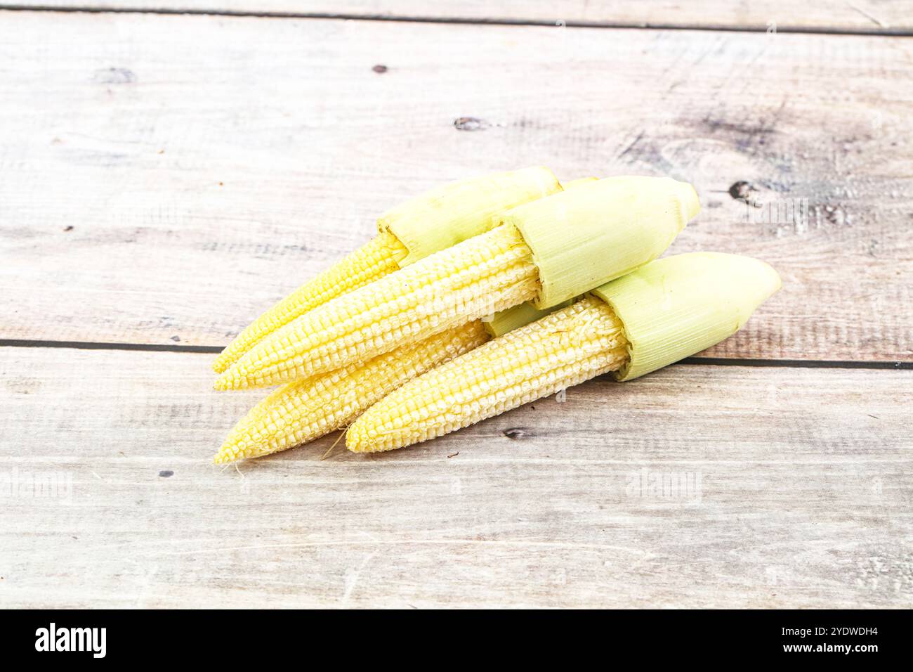 Small young sweet baby corn heap Stock Photo - Alamy