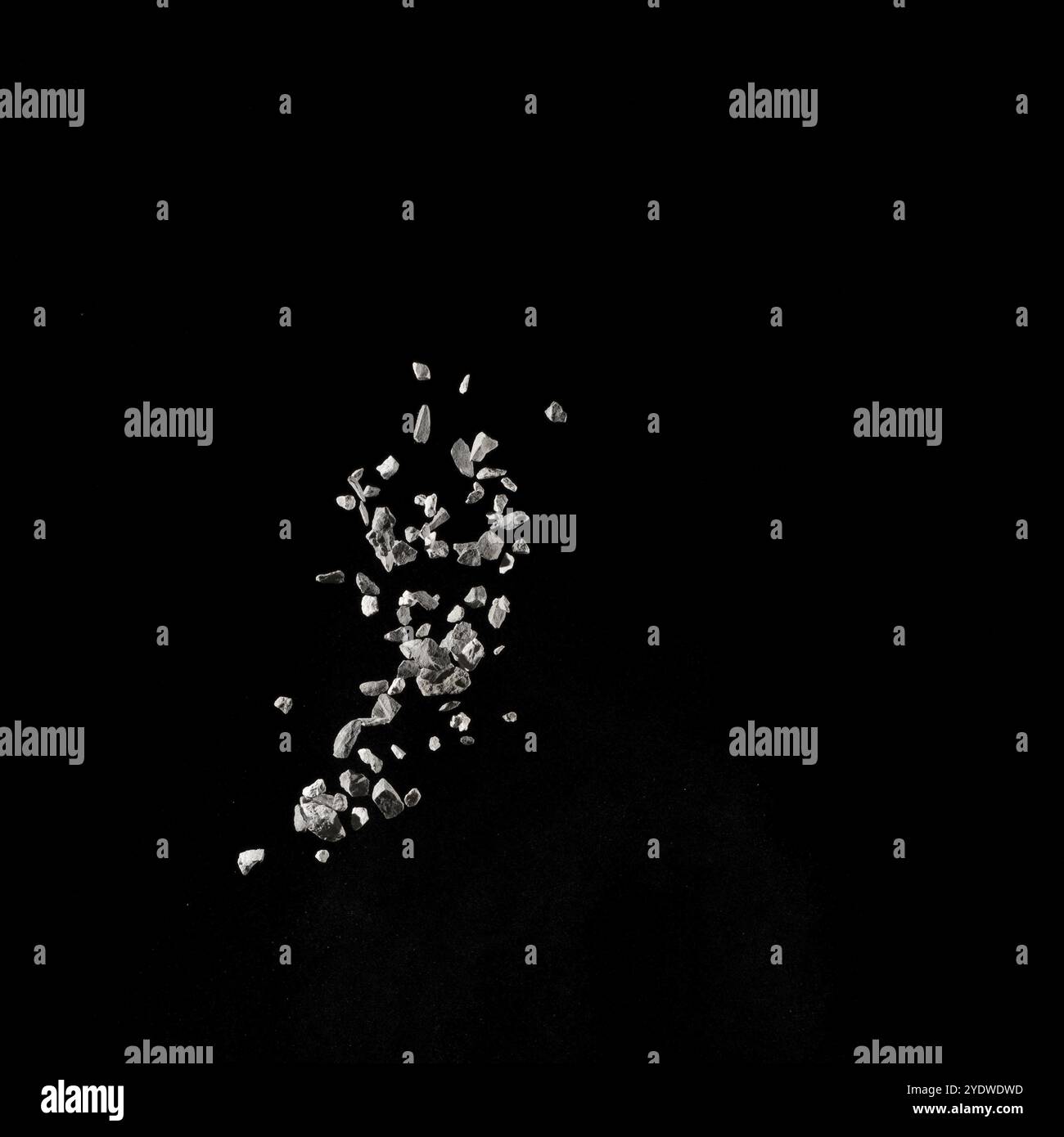 Mixed stone explosion on black background Stock Photo - Alamy