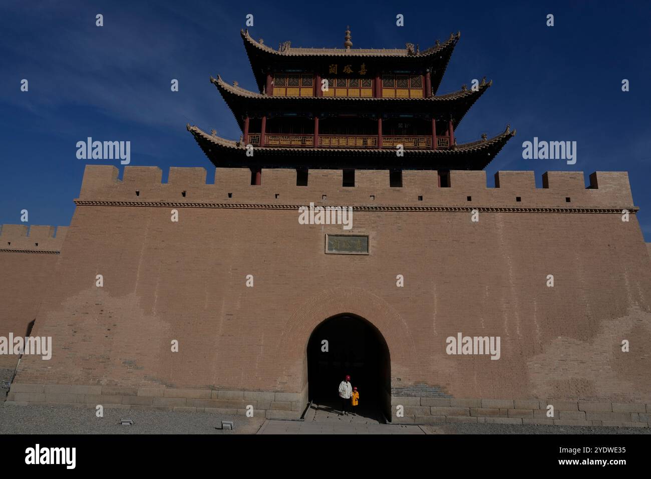 Tourists visit Jiayu Pass, a strategic point of the Great Wall of China ...