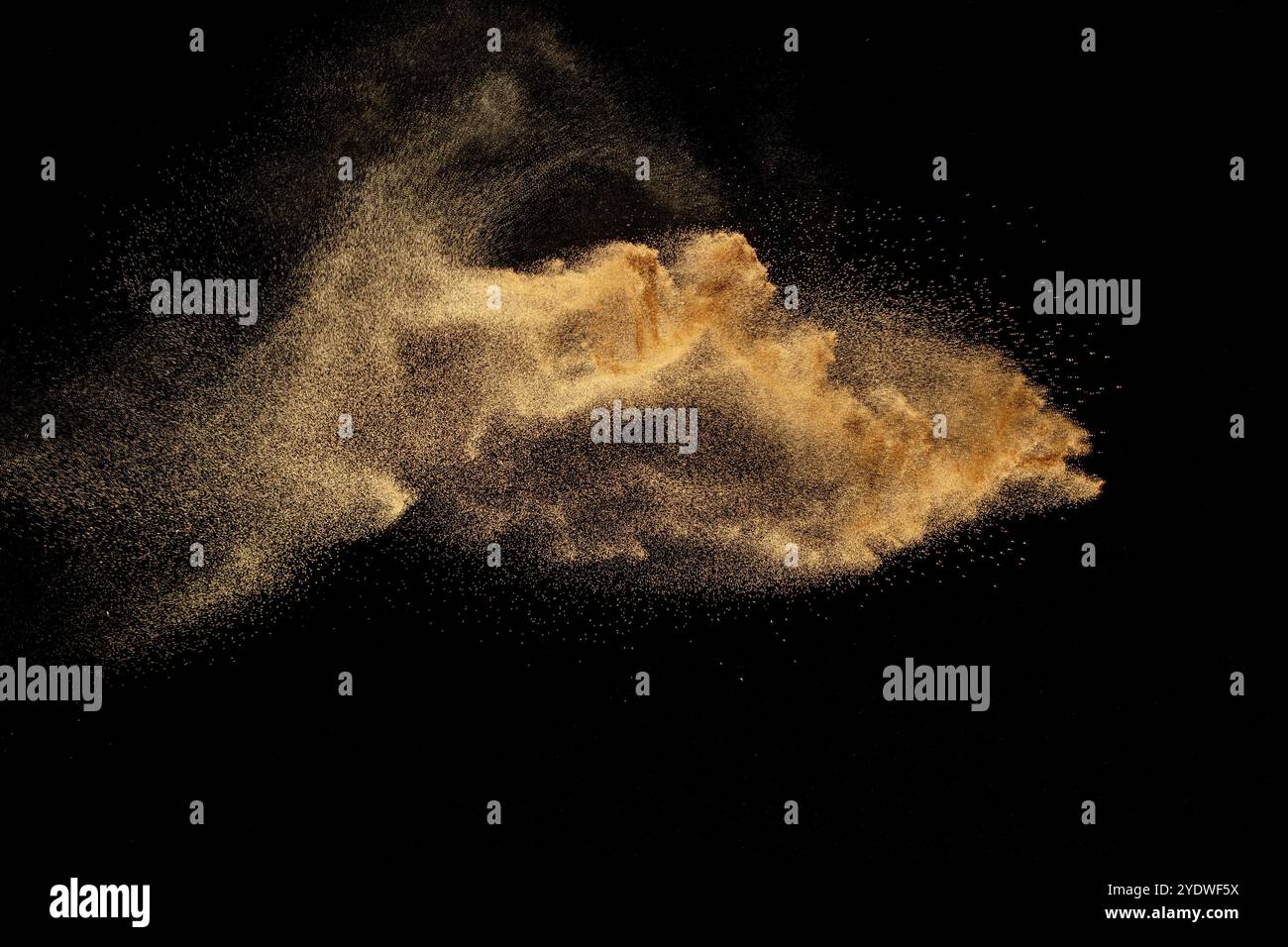 Dry river sand explosion. Brown colored sand splash against black ...