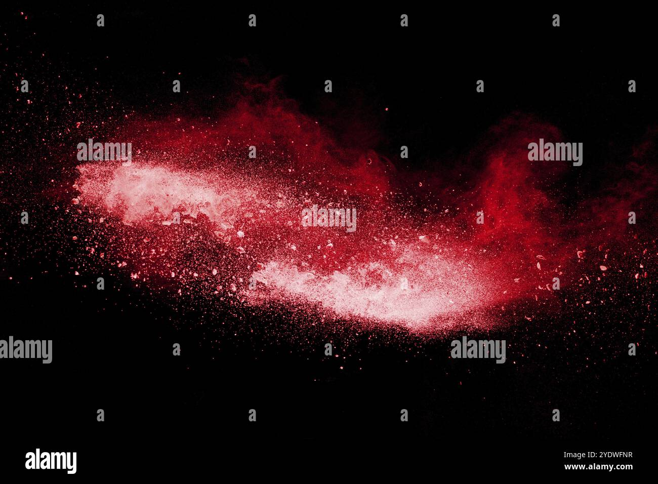 Red color powder explosion on black background.Freeze motion of red ...