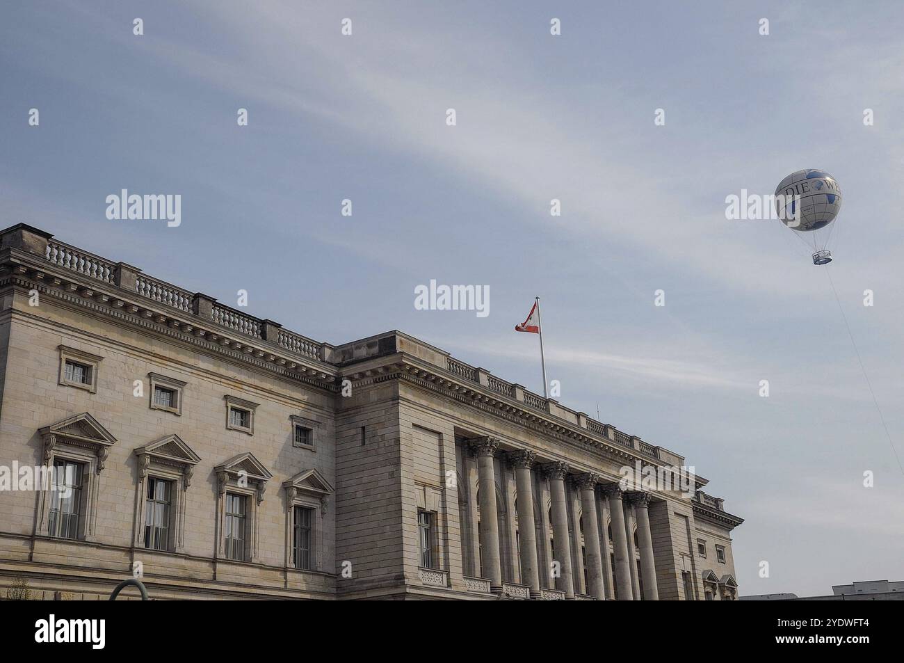 Historic building with a floating balloon in front of a blue sky ...