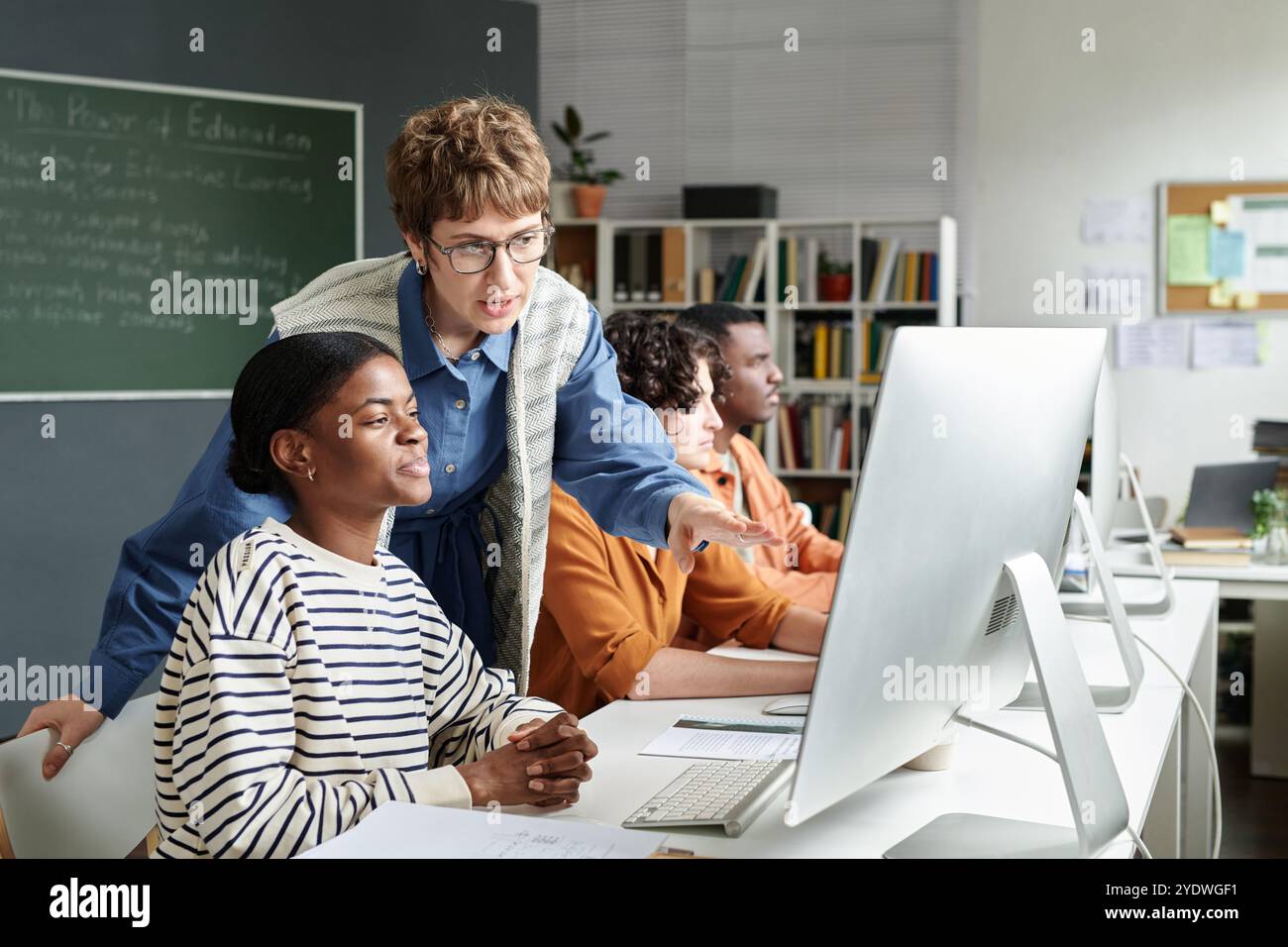 Teaching Classroom Filled With Students Using Computers Stock Photo - Alamy