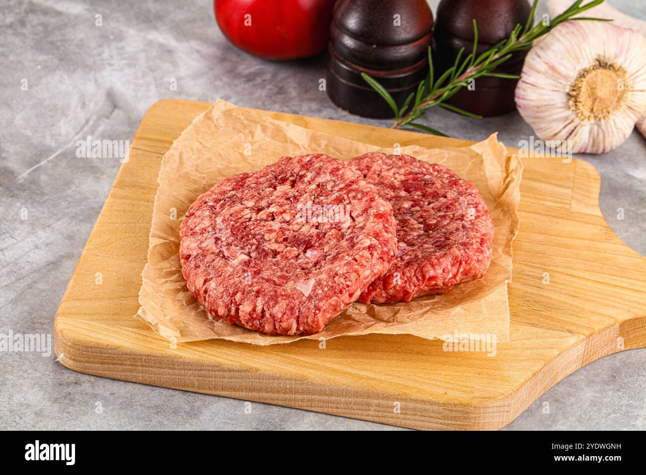 Raw round uncooked beef cutlet minced meat Stock Photo - Alamy