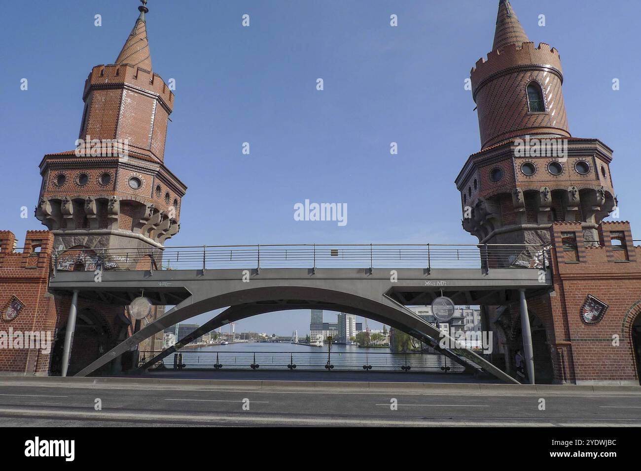 Historic brick bridge with two towers over a river, Berlin, Germany ...