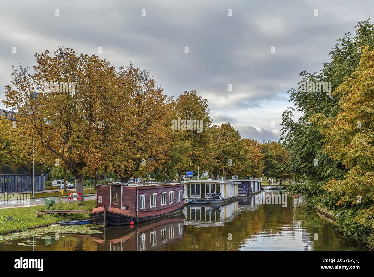 Channel with barges for housing in Leiden, Netherlands Stock Photo - Alamy