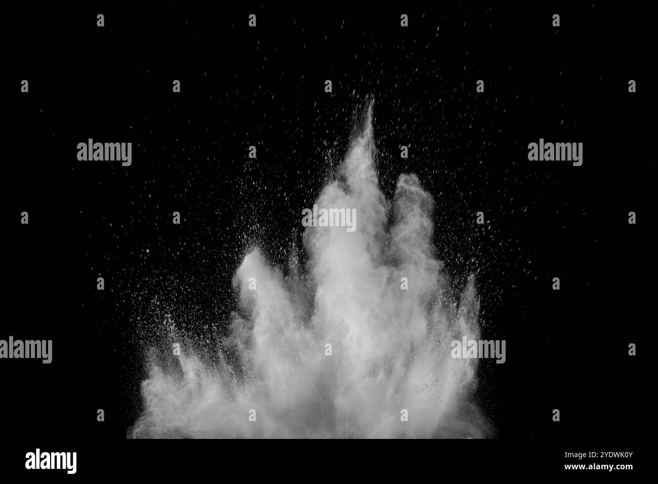 Bizarre forms of white powder explosion cloud against black background ...
