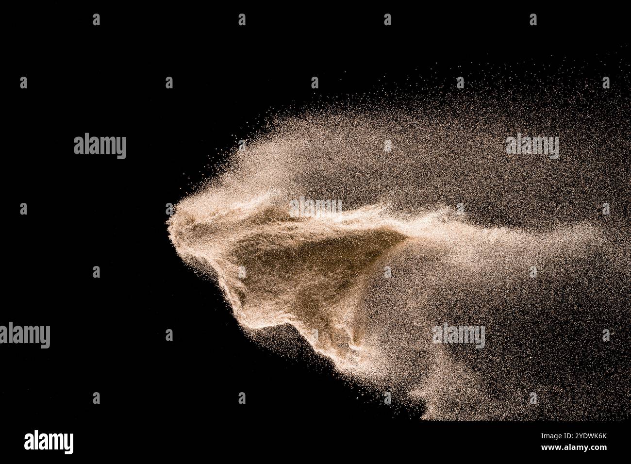 Dry river sand explosion. Golden colored sand splash against dark ...