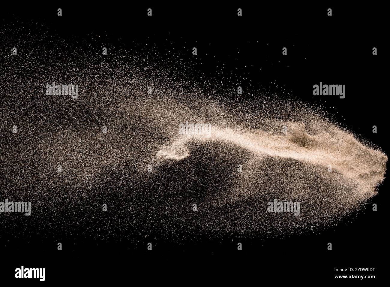 Dry river sand explosion. Golden colored sand splash against dark ...