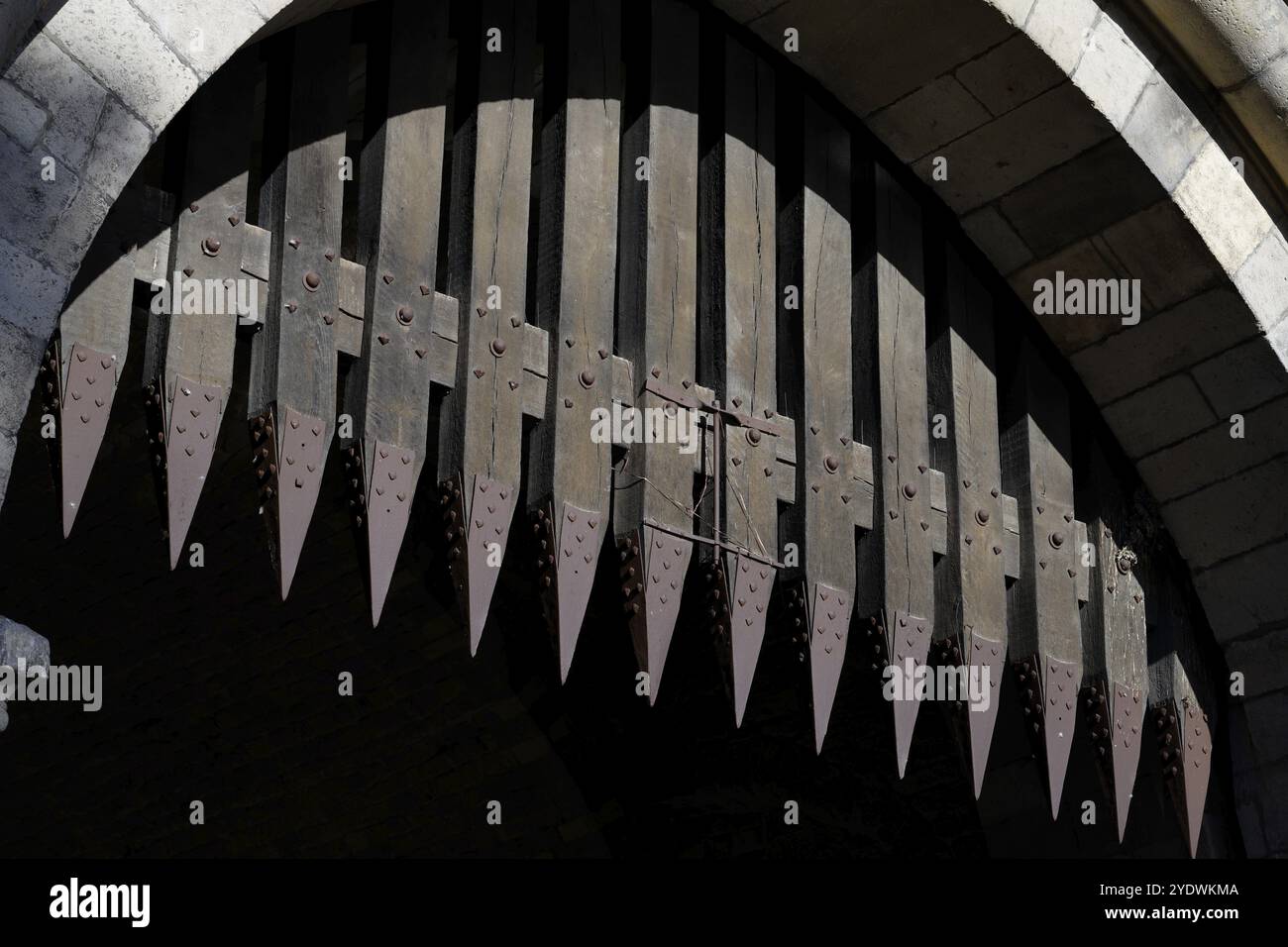 A portcullis with metal spikes from a medieval gate castle in Cologne ...