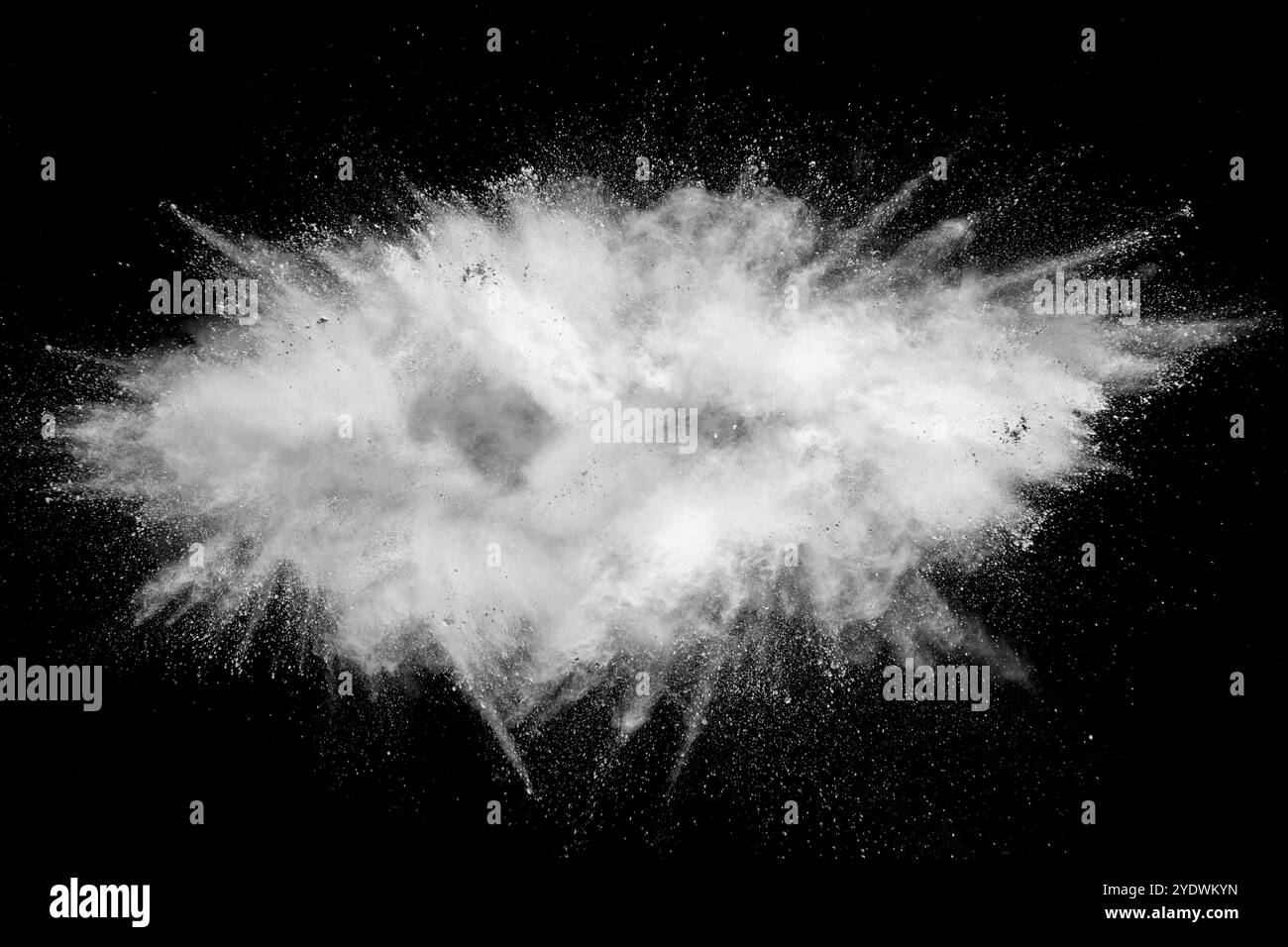 White powder explosion isolated on black background. White dust ...