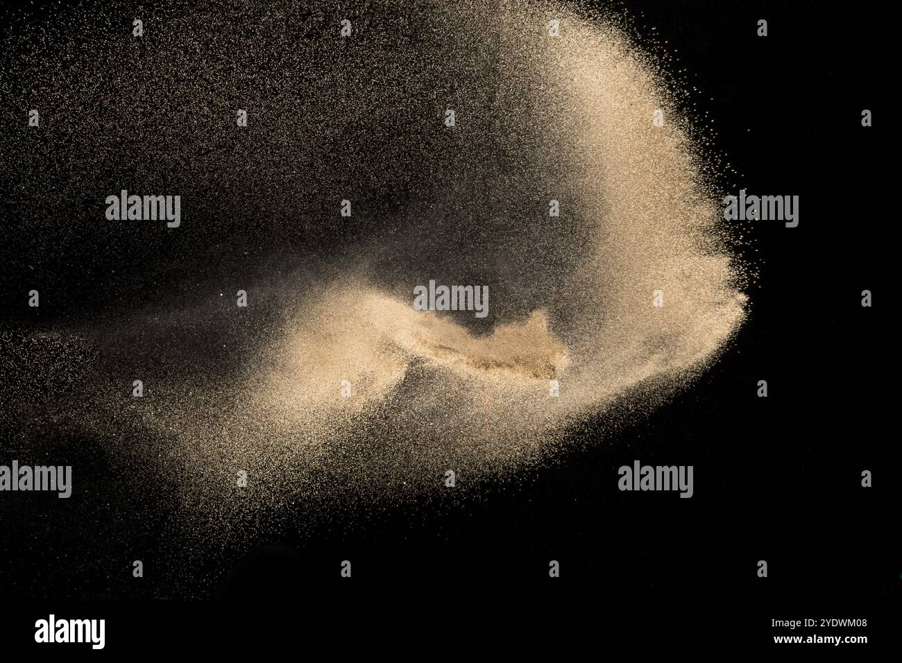 Dry river sand with stone explosion. Yellow colored sand splash against ...