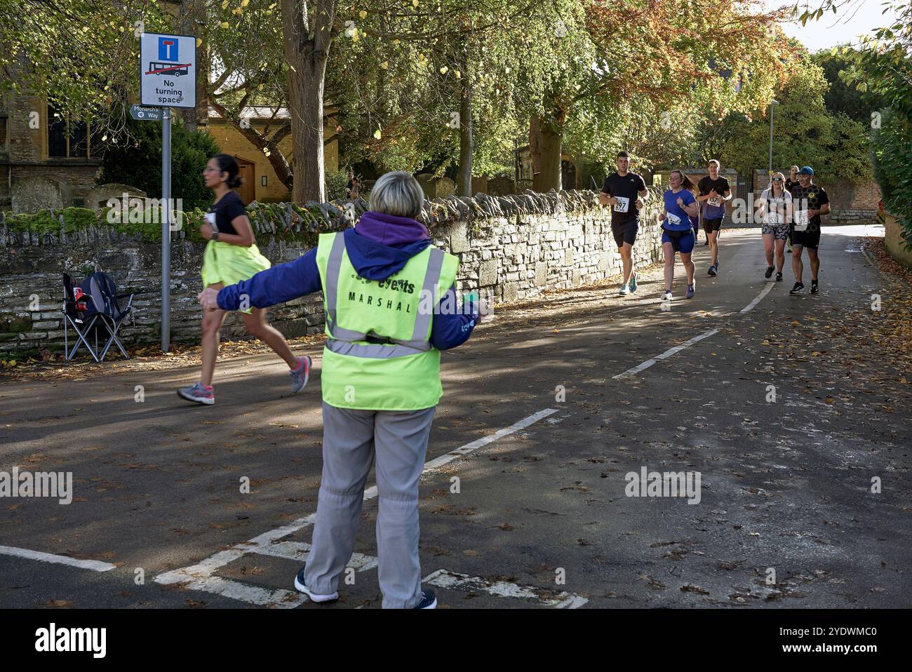 Directing runners hi-res stock photography and images - Alamy