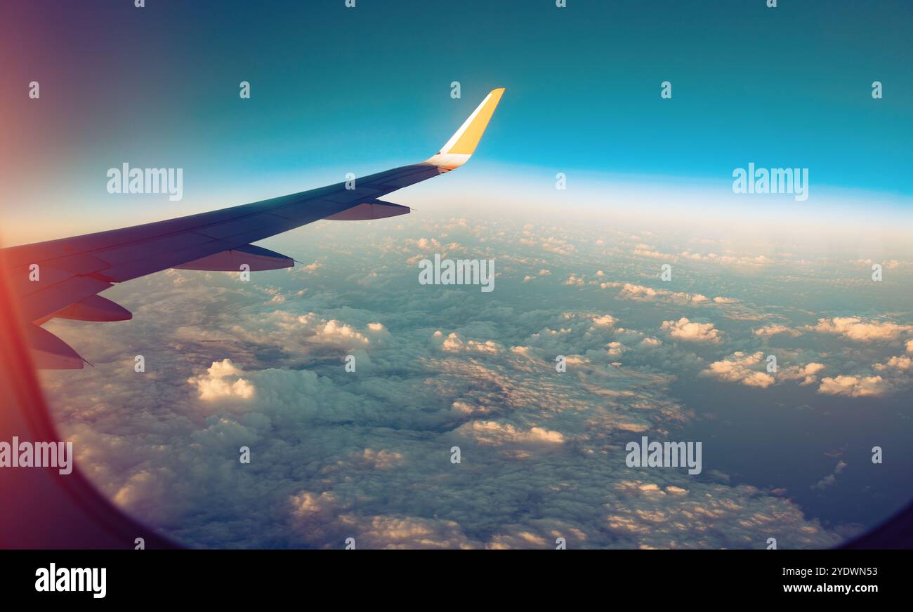 Concept of airplane travel. Flying above the city. Scenery sunset ...