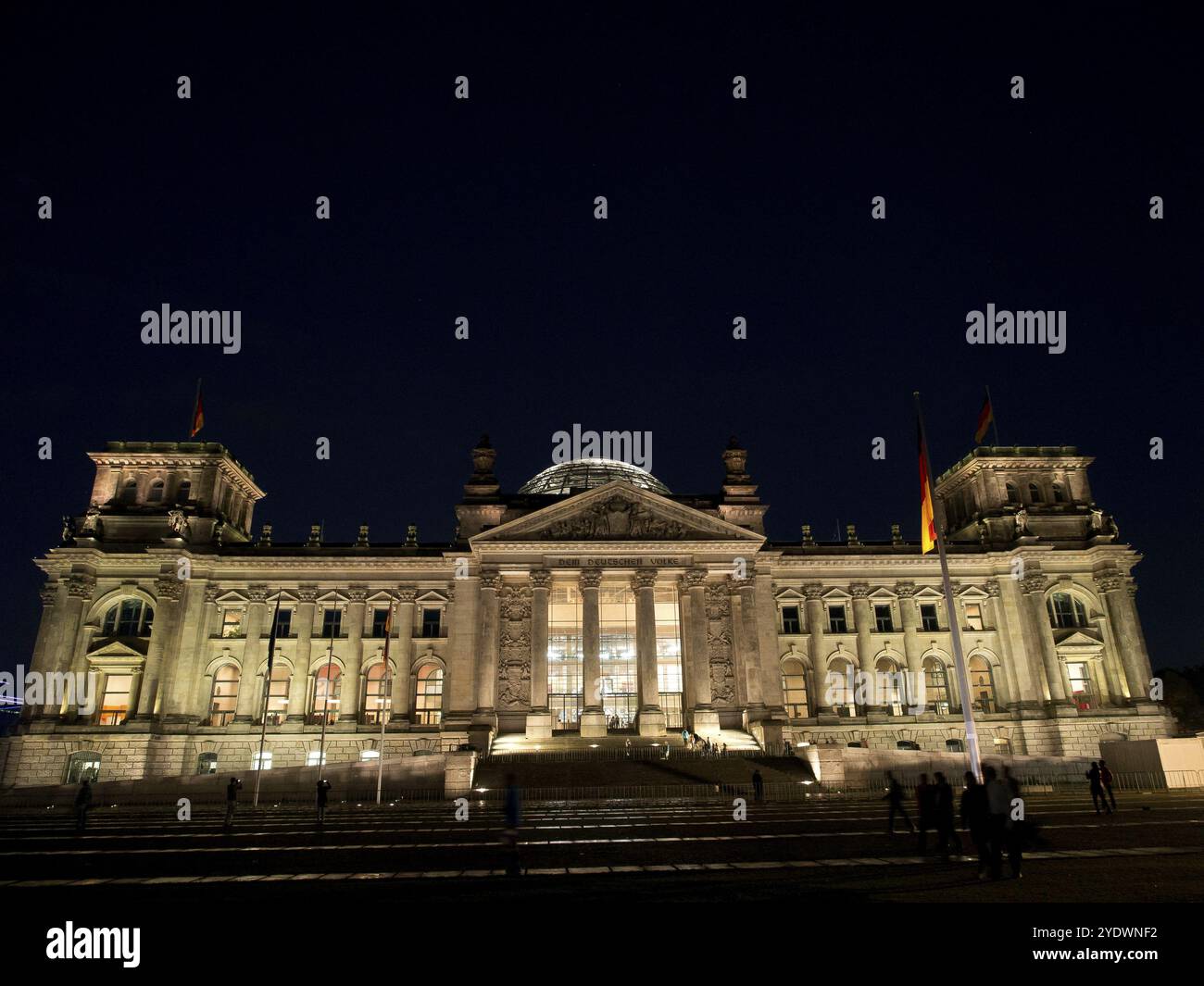 Building illuminated at night with symmetrical glass dome, Berlin ...