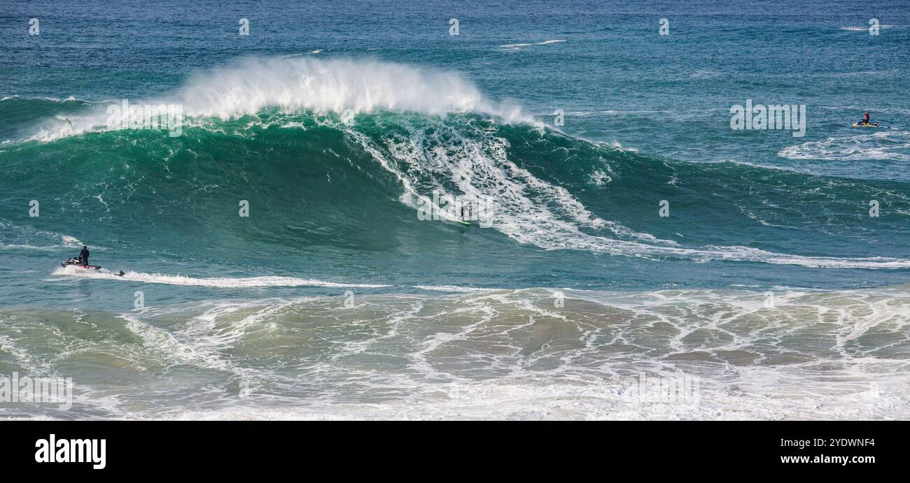 Big waves at Nazarè beach in Portugal, photographs of surfers having ...