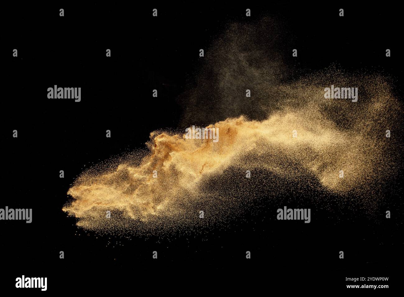 Dry river sand explosion. Brown colored sand splash against black ...