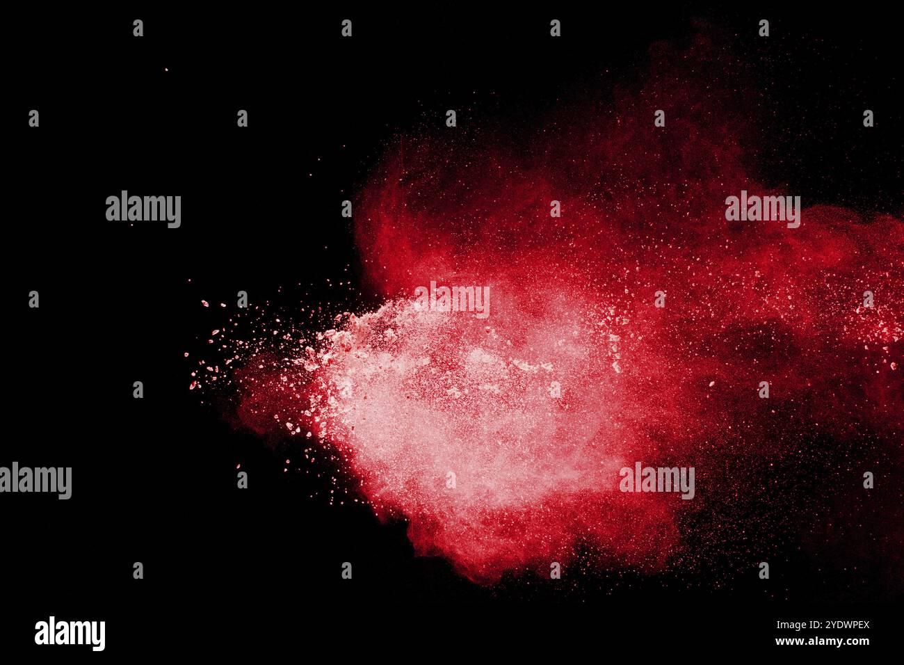 Red color powder explosion on black background.Freeze motion of red ...