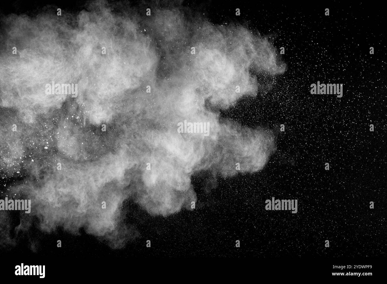 Bizarre forms of white powder explosion cloud against black background ...