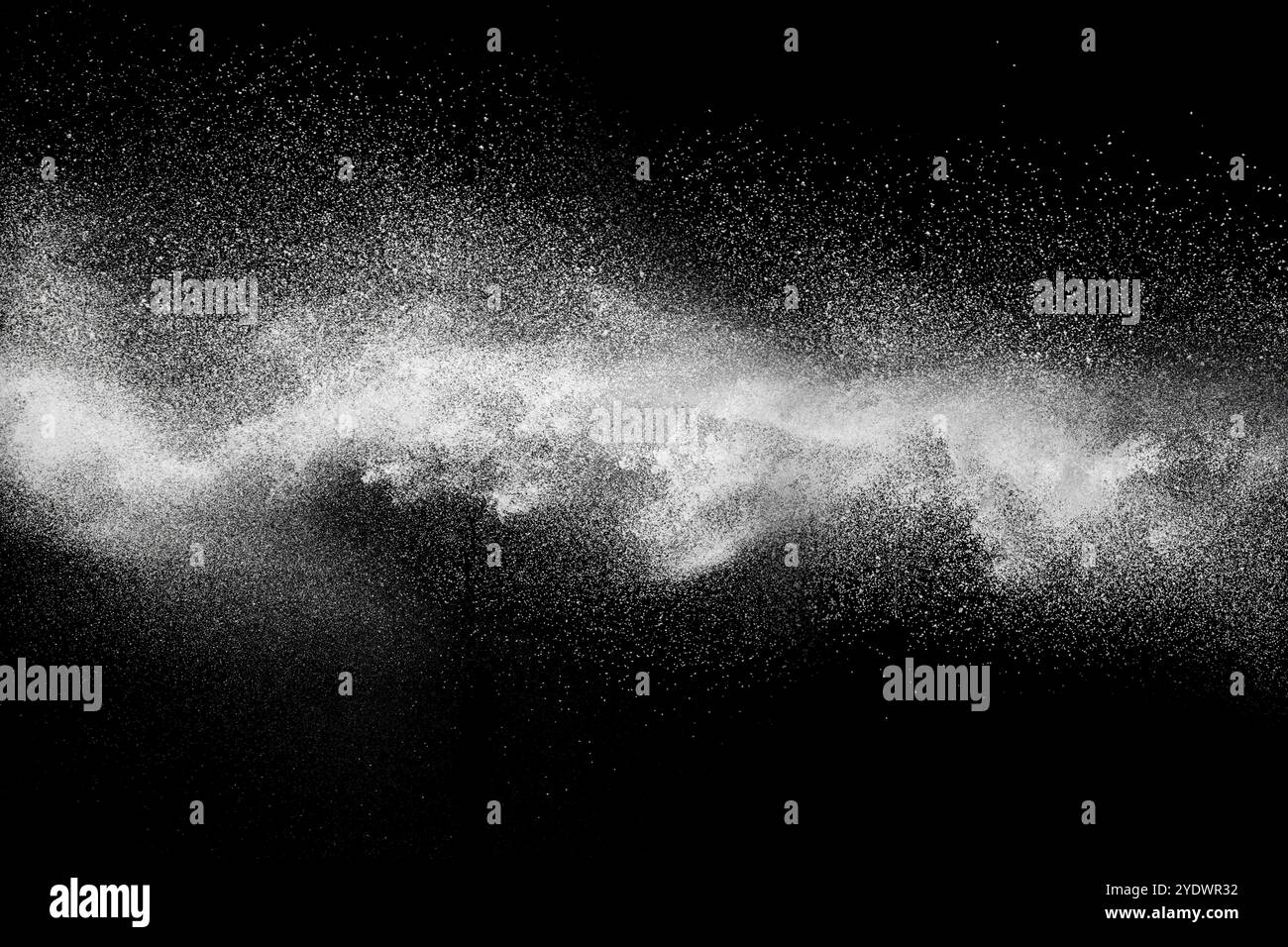 Bizarre forms of white powder explosion cloud against black background ...