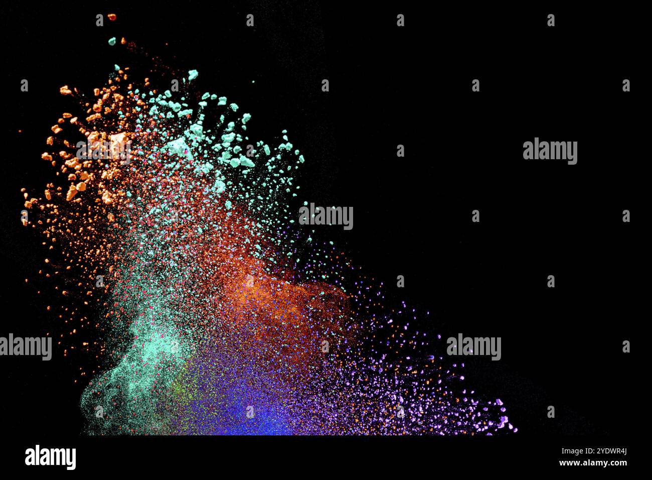 Multicolored powder explosion on black background.Launched colorful ...