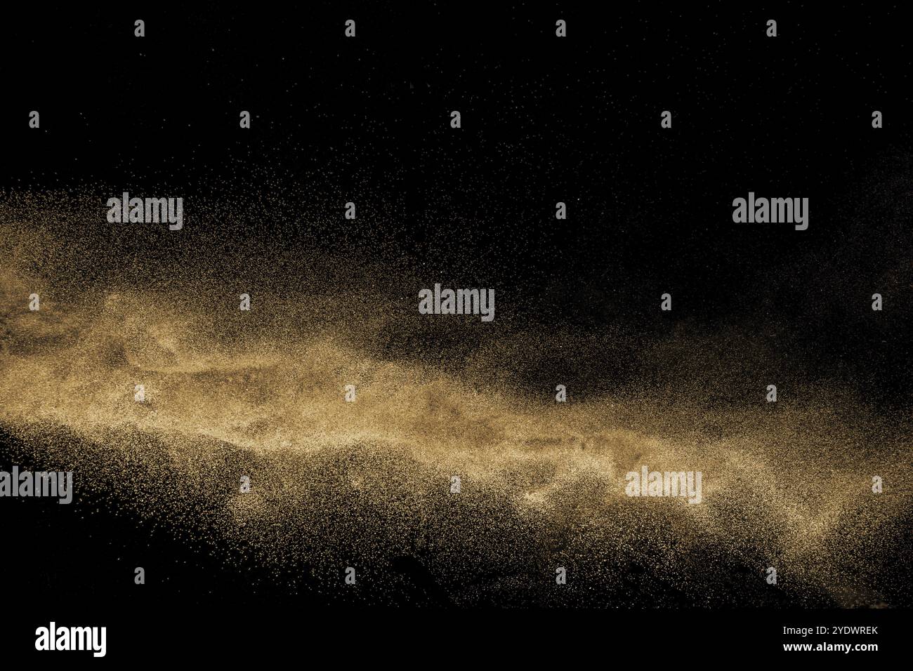 Dry river sand with stone explosion. Yellow colored sand splash agianst ...