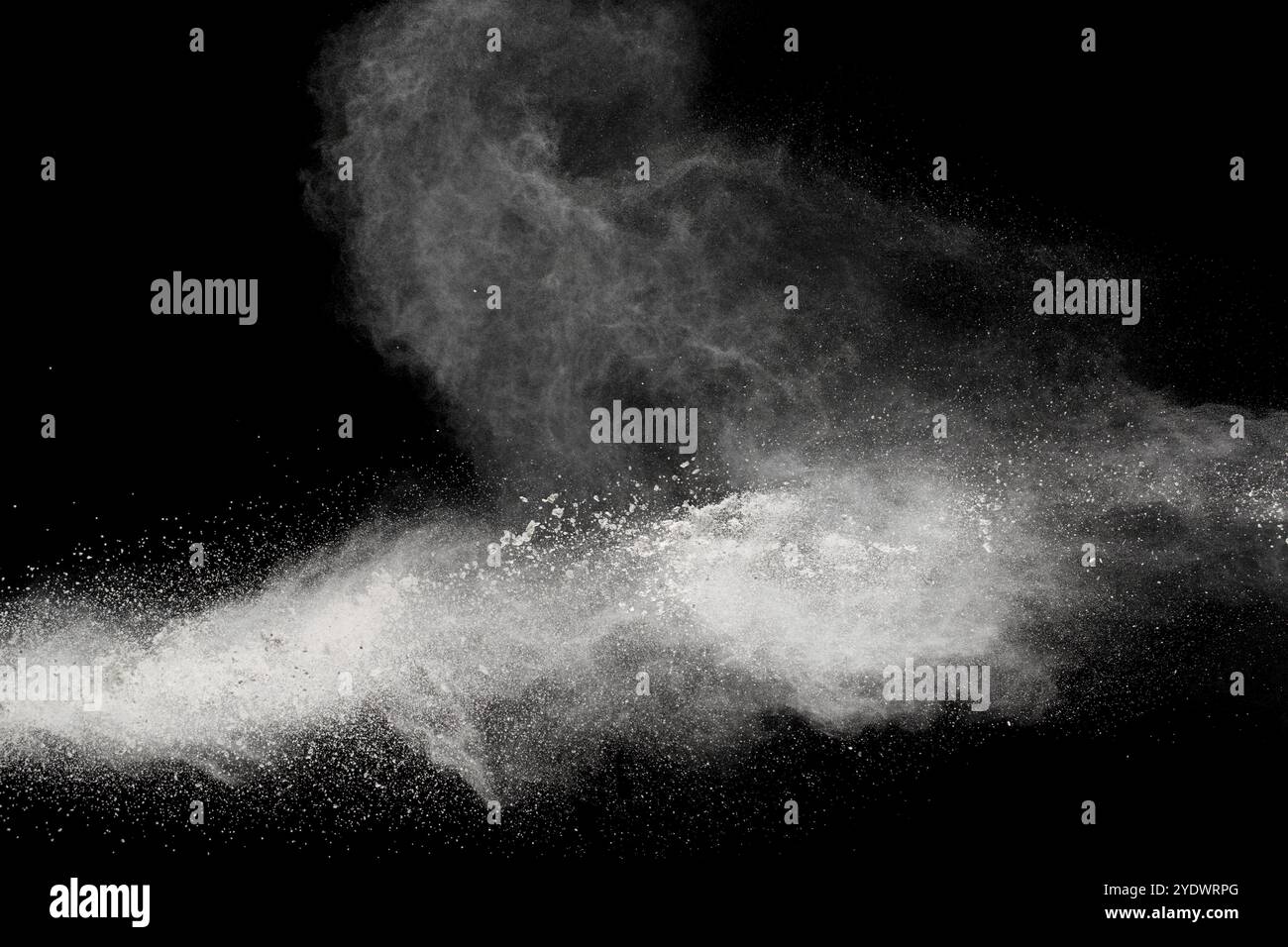 Bizarre forms of white powder explosion cloud against black background ...