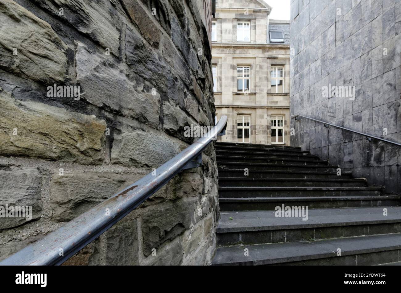 Staircase passage with railings in the historic city centre of Cologne ...
