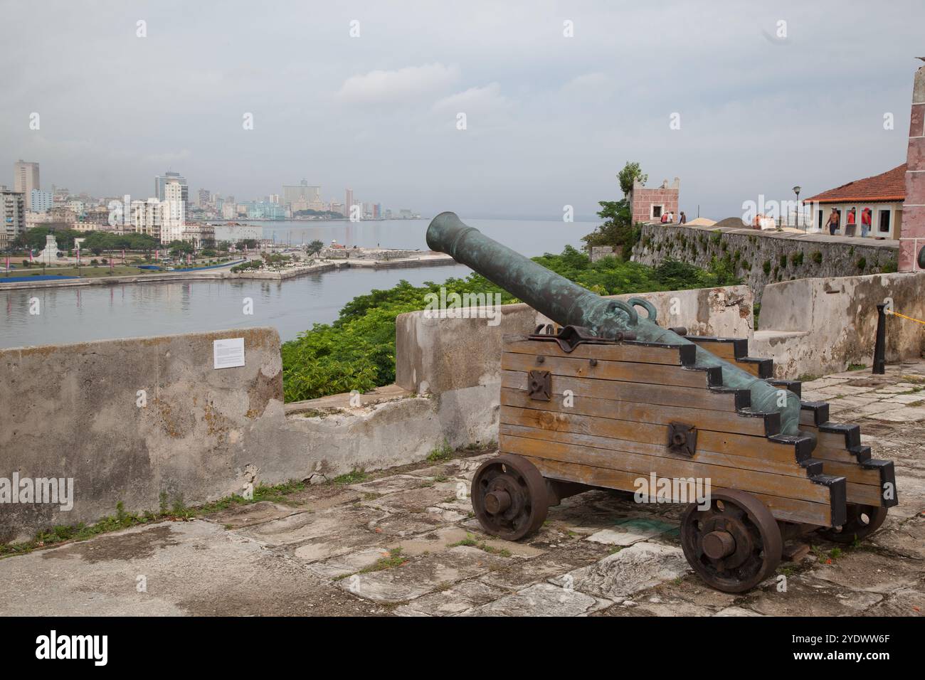 A historical bronze Cannon and downtown on the other side of the bay ...