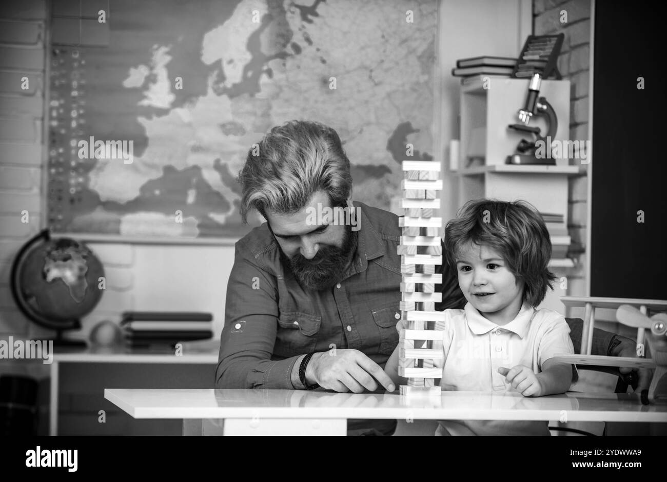 Children playing stacking blocks Black and White Stock Photos & Images ...
