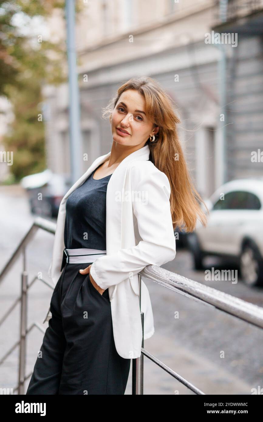 Elegant woman poses confidently hi-res stock photography and images - Alamy