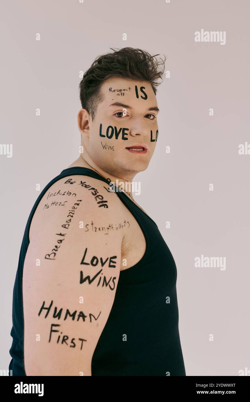 A queer individual confidently showcases powerful messages of love and ...