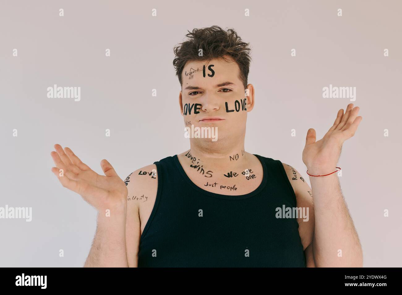 A queer person expresses love and unity with artistic body markings in ...