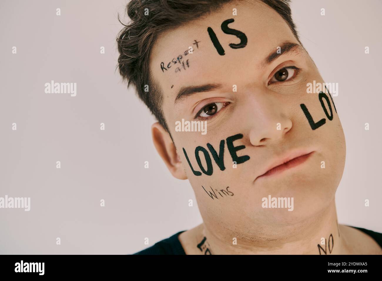 A queer person showcases their unique identity with powerful messages ...