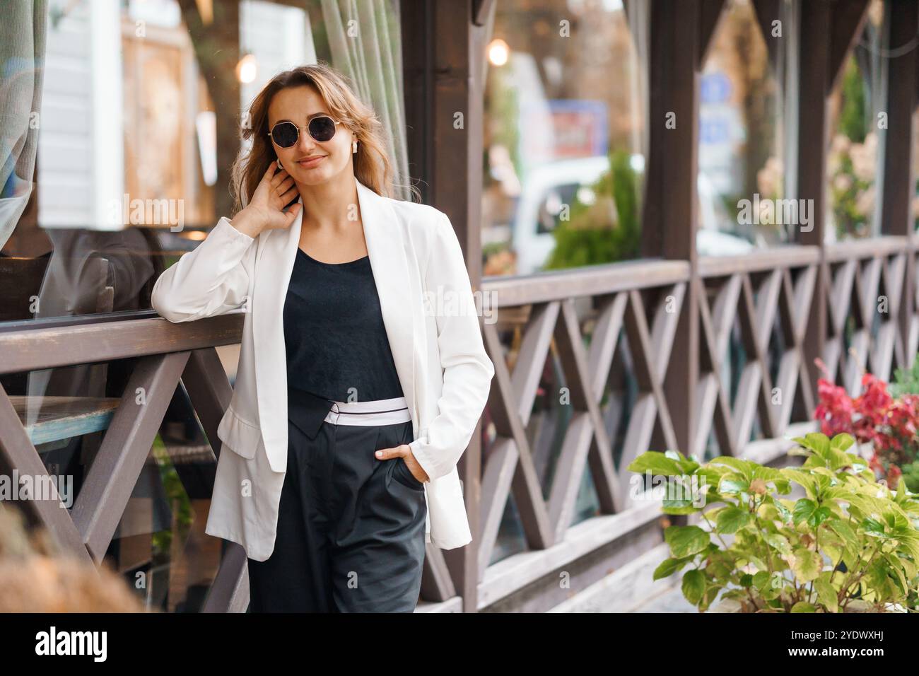 Stylish woman elegantly poses hi-res stock photography and images - Alamy